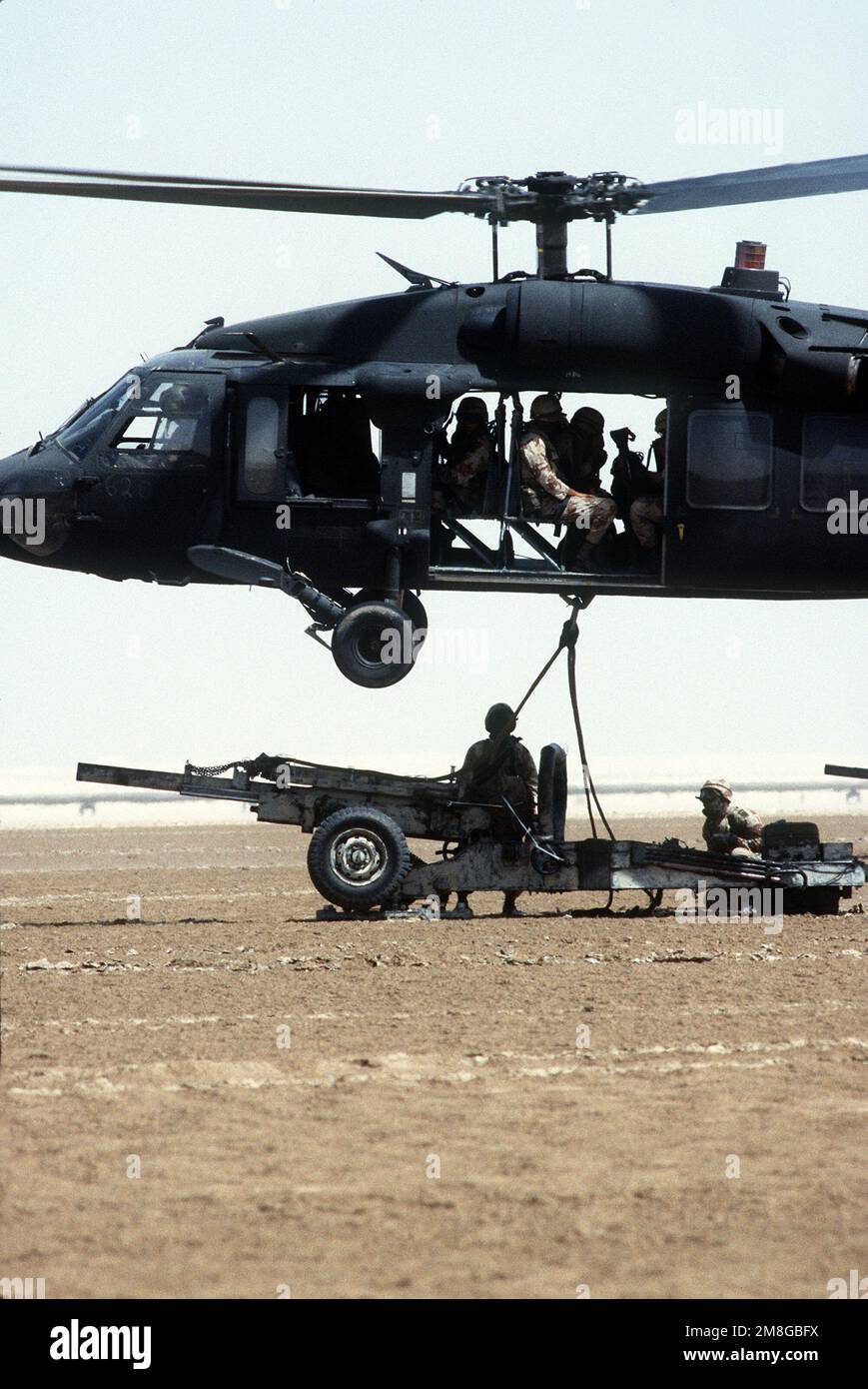 Members of C Btry., 1ST Bn., 319th Air Field Arty. Regt., attach an M ...
