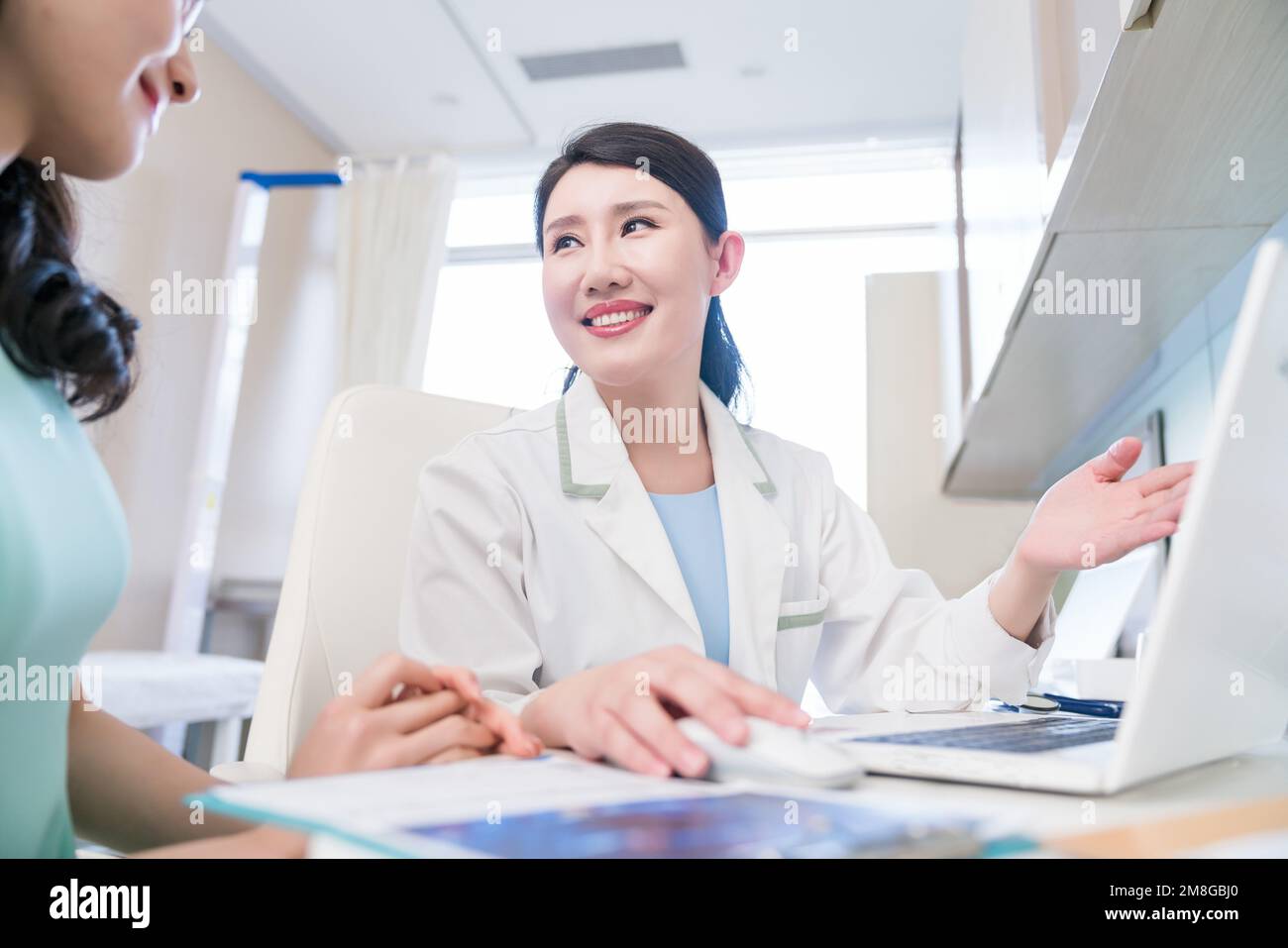 Professional reception young woman Stock Photo - Alamy