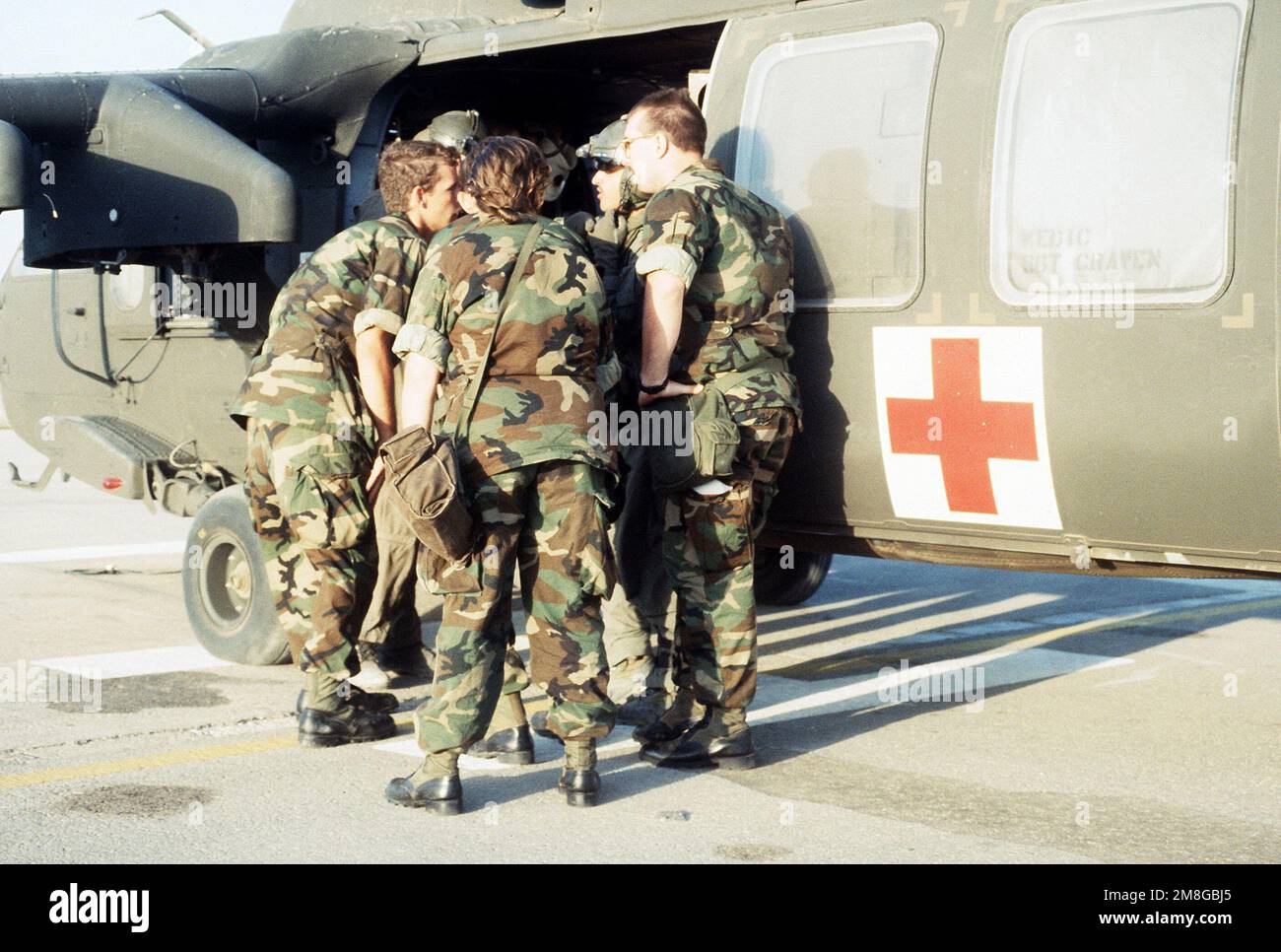 Corpsmen from Fleet Hospital 5 prepare to carry a soldier from a U.S ...
