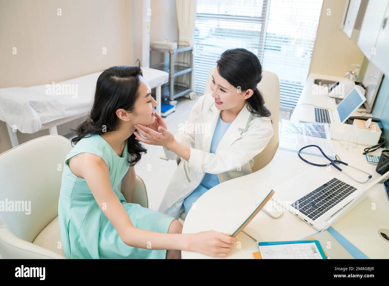 Professional reception young woman Stock Photo - Alamy