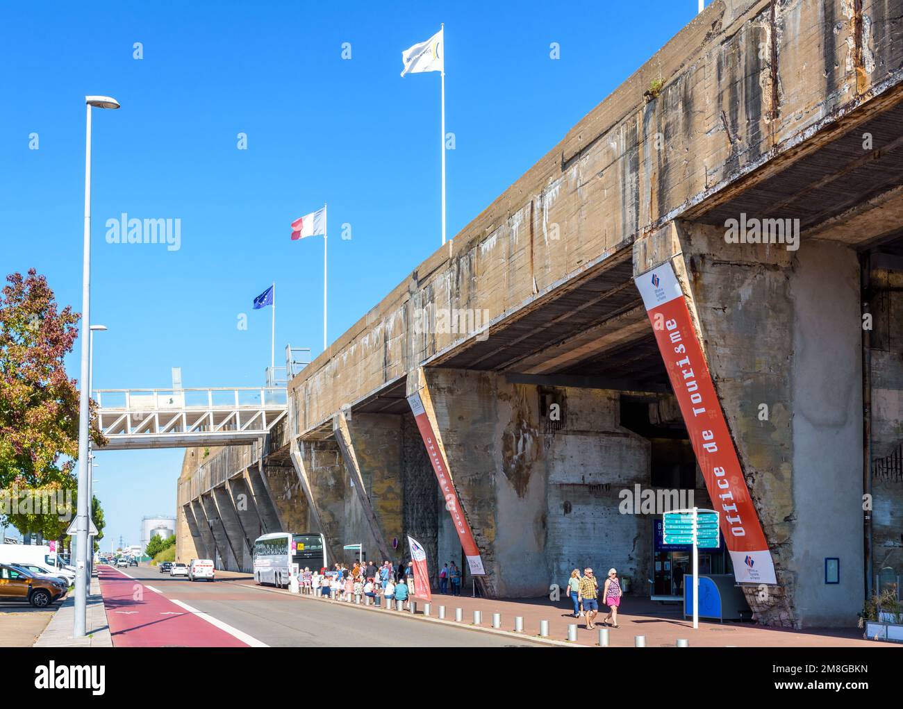 Senior tourists wait for a guided tour of the port in front of the ...