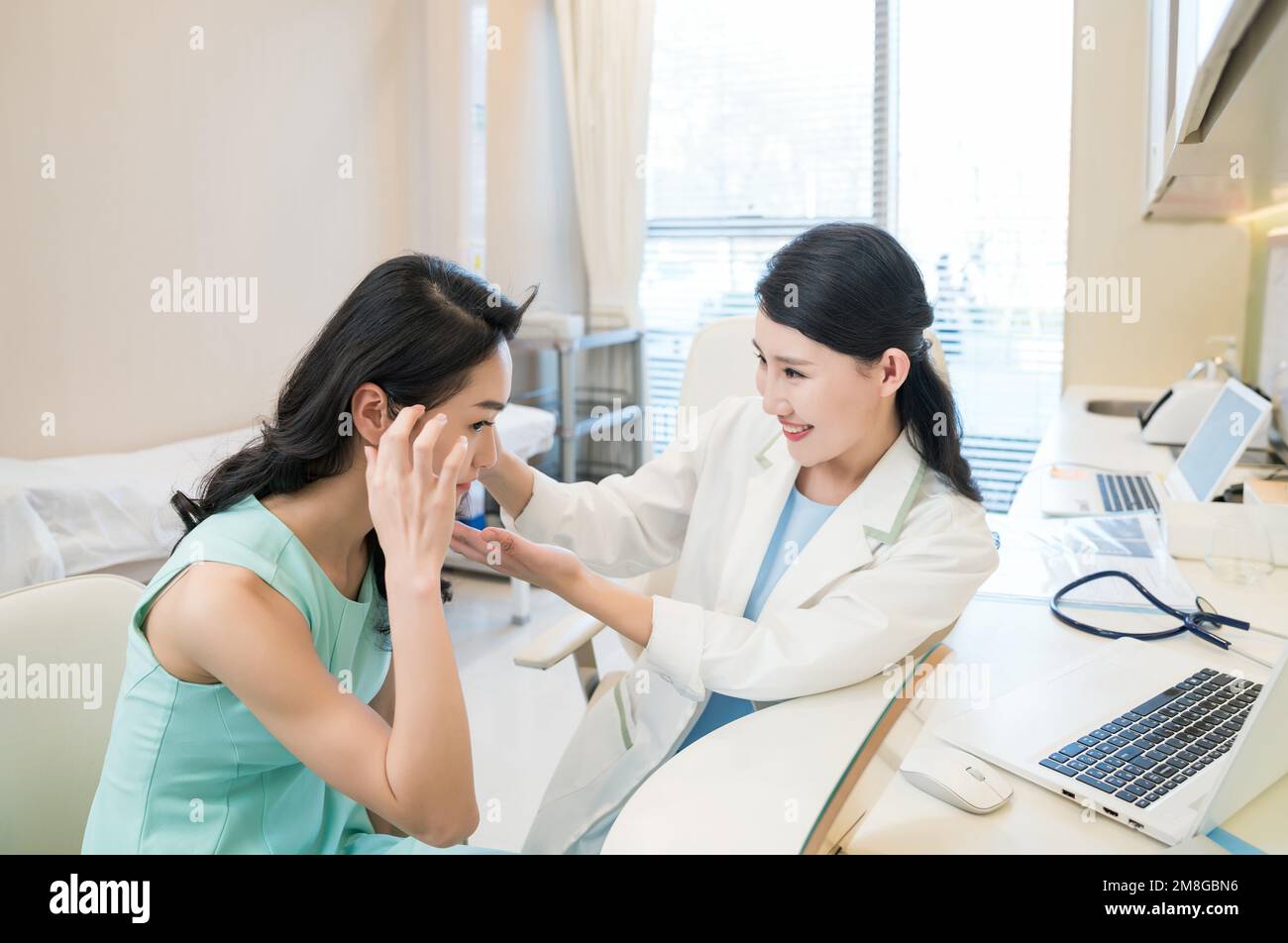 Professional reception young woman Stock Photo - Alamy