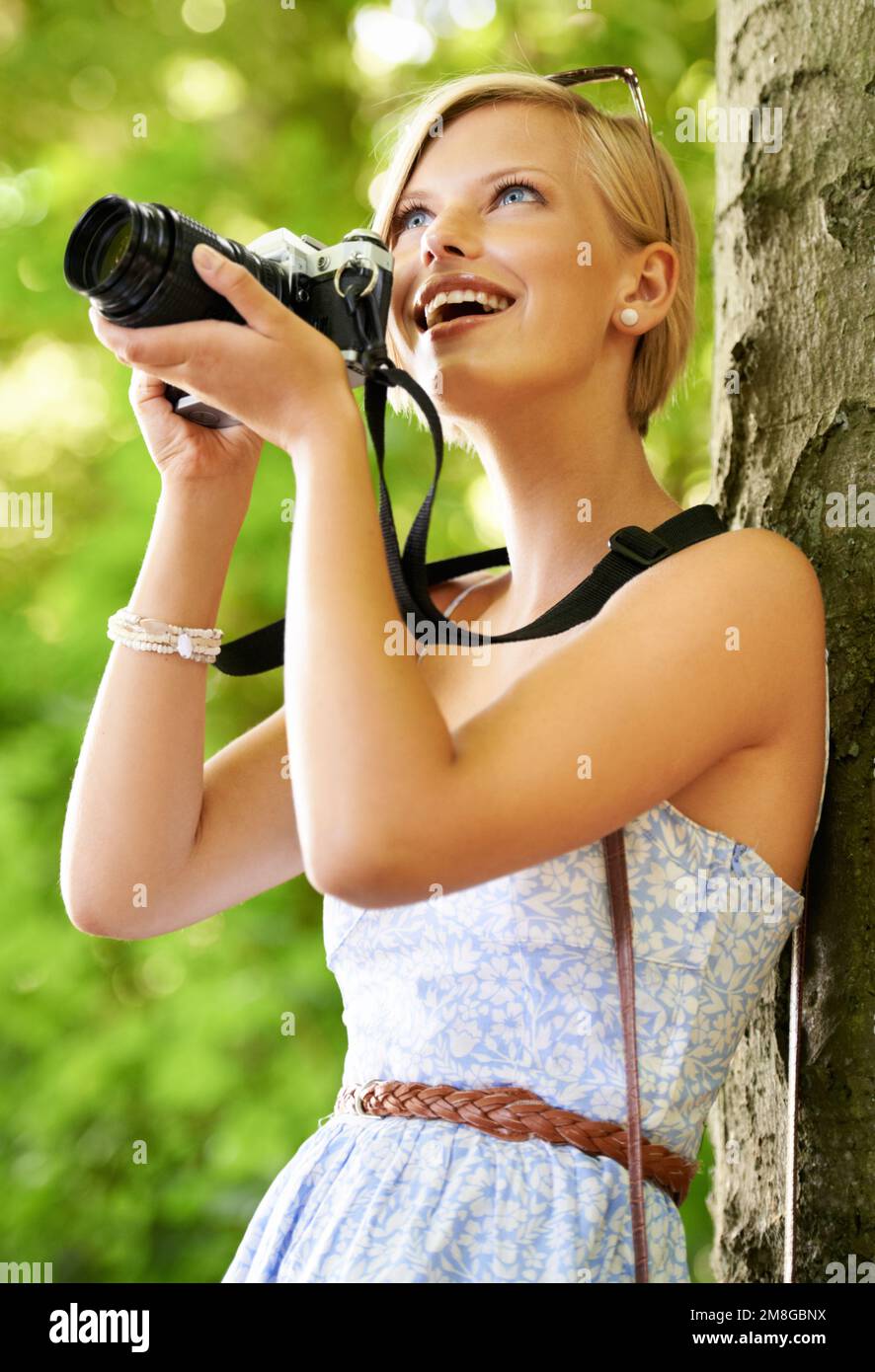 Quick, I mustnt miss this shot. Cute young photographer holding her ...