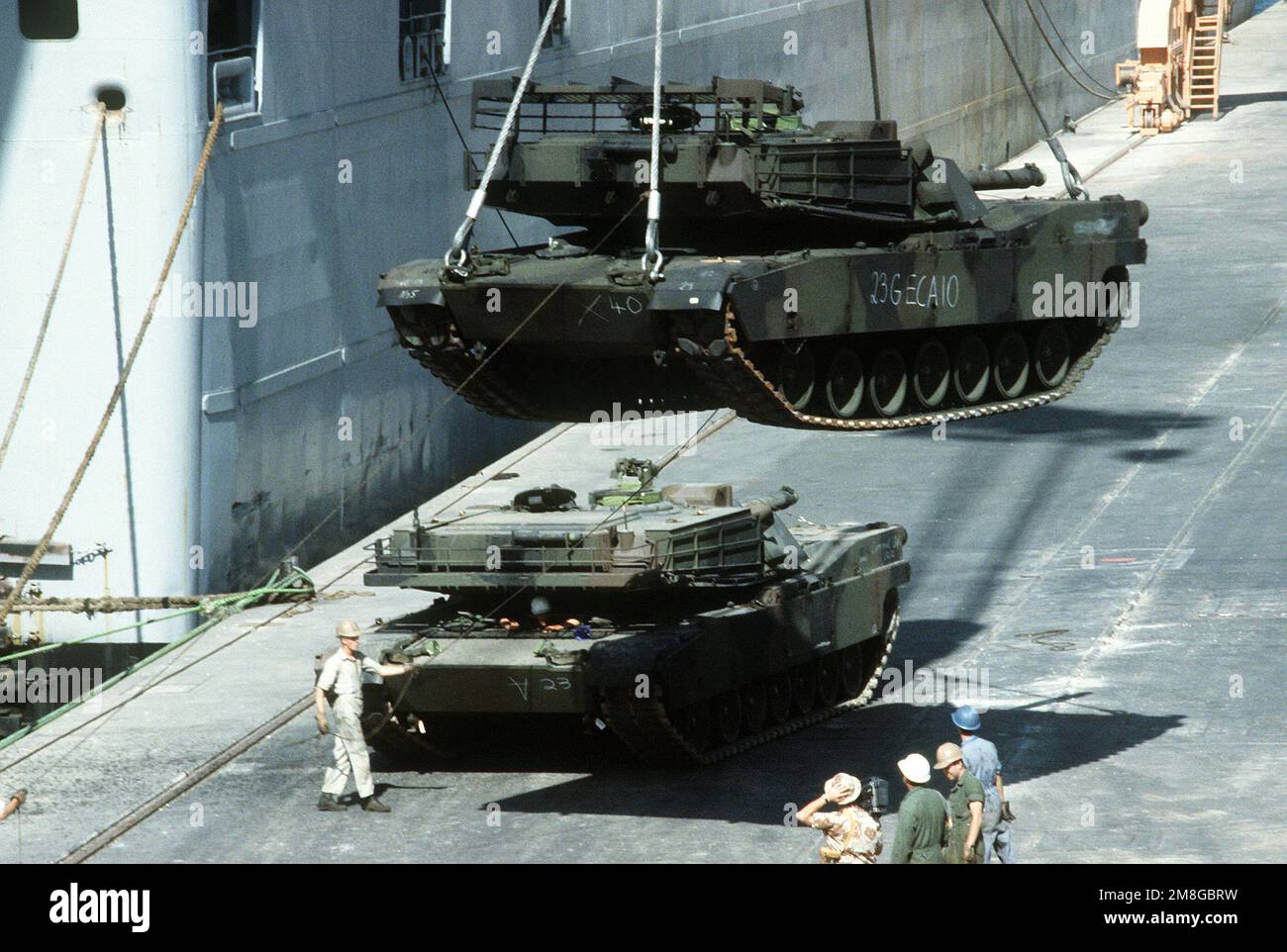A crane lifts an M-1A1 Abrams main battle tank from the Ready Reserve ...