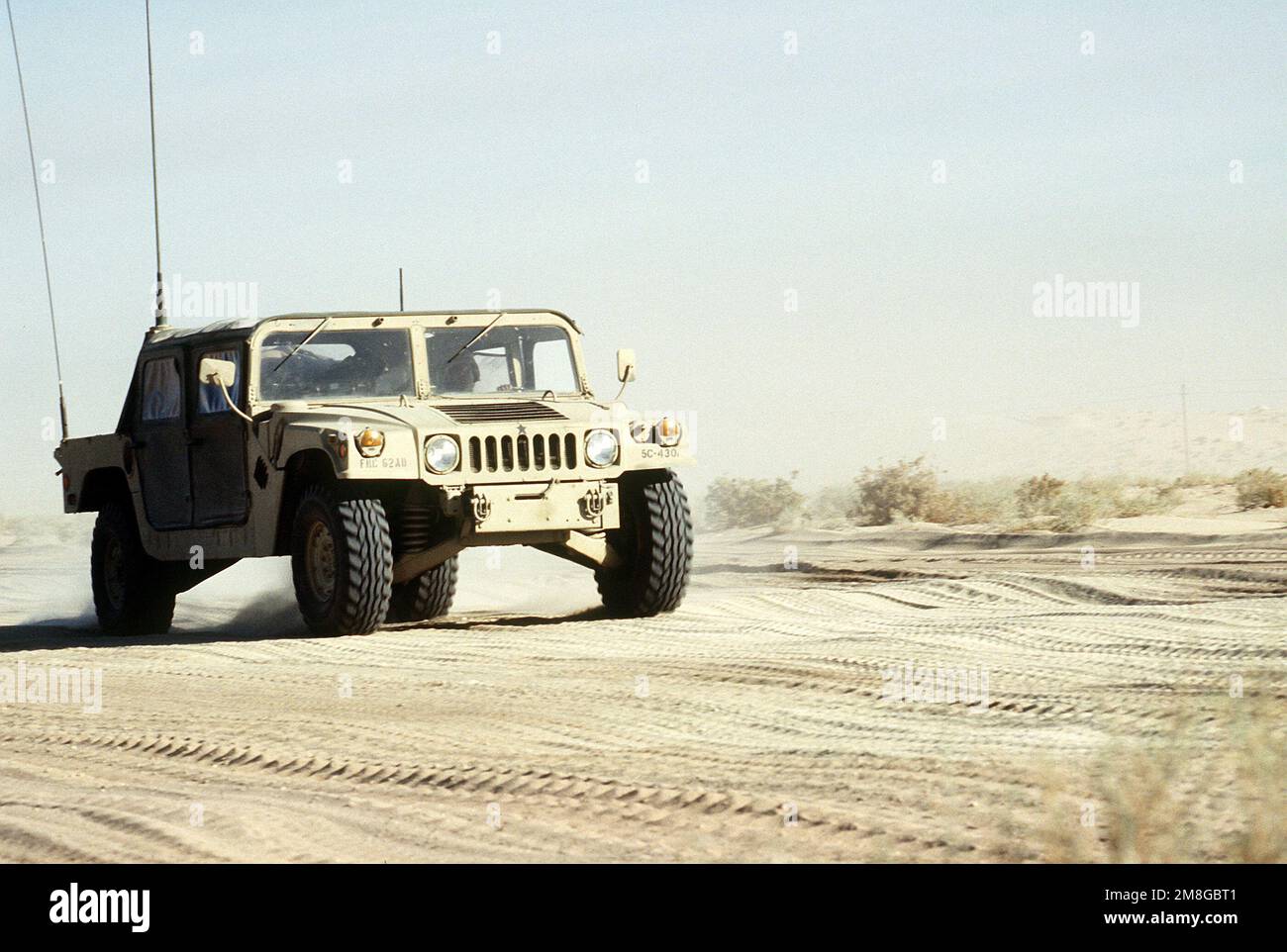 An M1038 High-Mobility Multipurpose Wheeled Vehicle (HMMWV) leads a ...