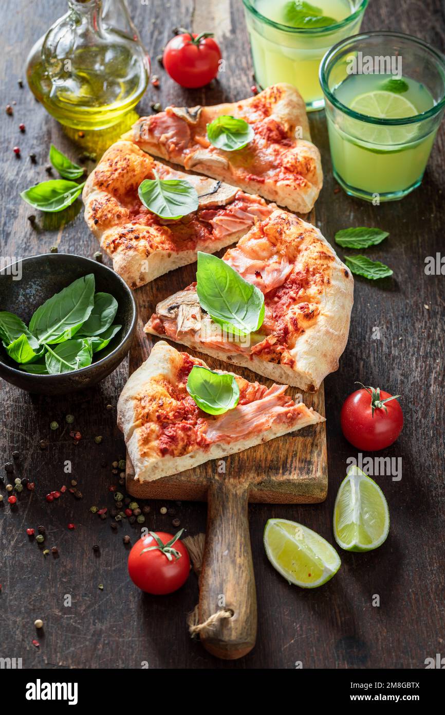 Spicy Capricciosa pizza ready to eat. Classic Italian cuisine ...