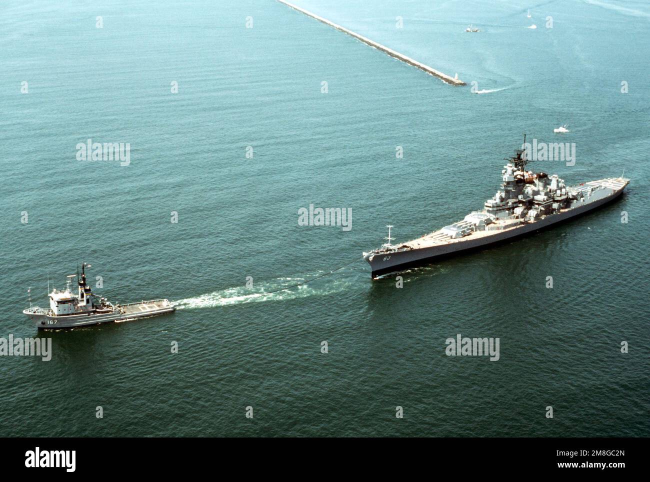The recently decommissioned battleship USS MISSOURI (BB 63) is towed ...