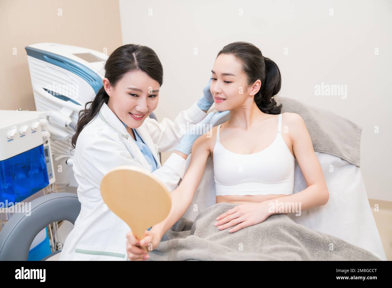 Professional reception young woman Stock Photo - Alamy