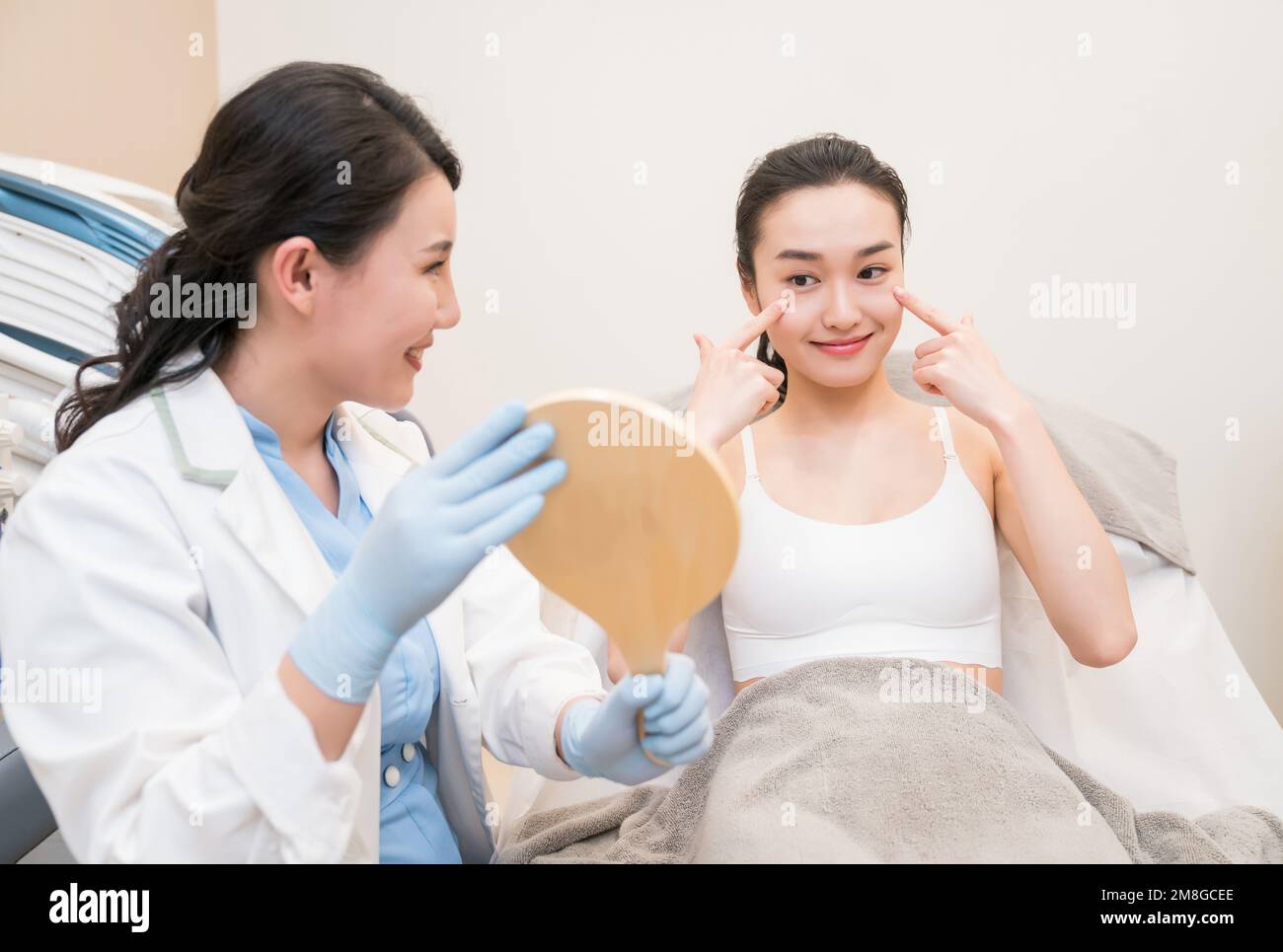 Professional reception young woman Stock Photo - Alamy