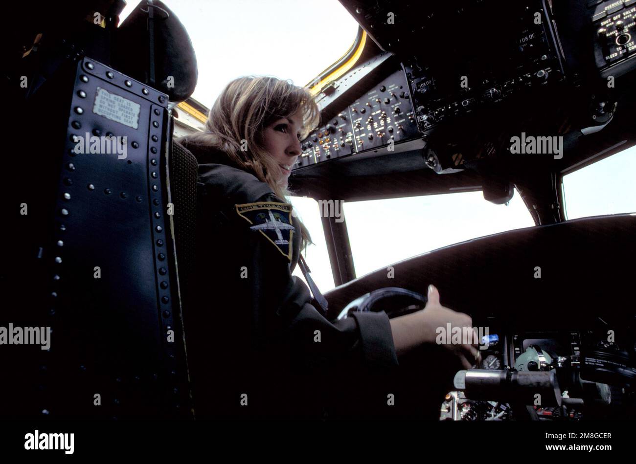 LTJG Tamela Redford conducts a preflight check in the cockpit of her C ...