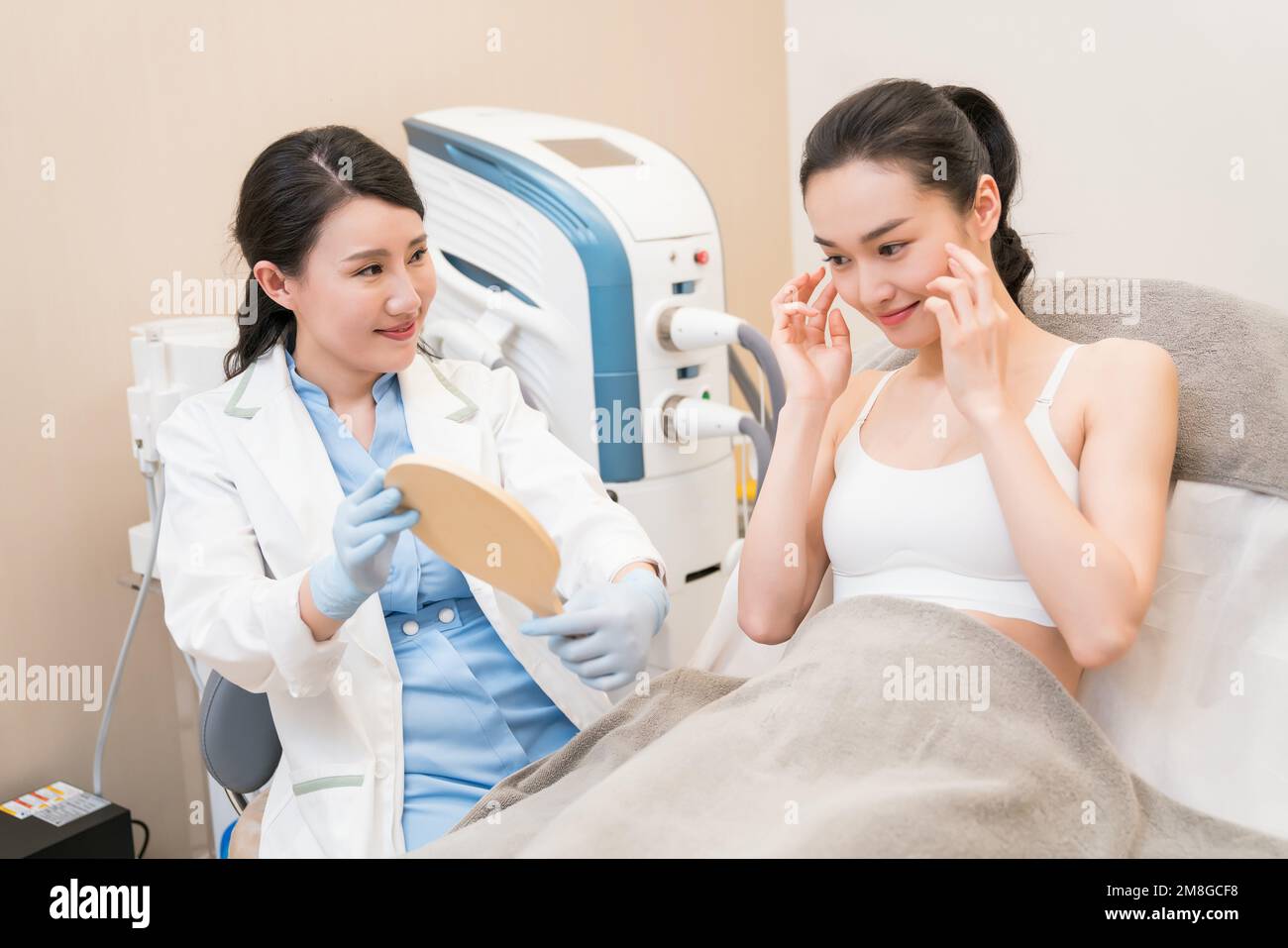 Professional reception young woman Stock Photo - Alamy