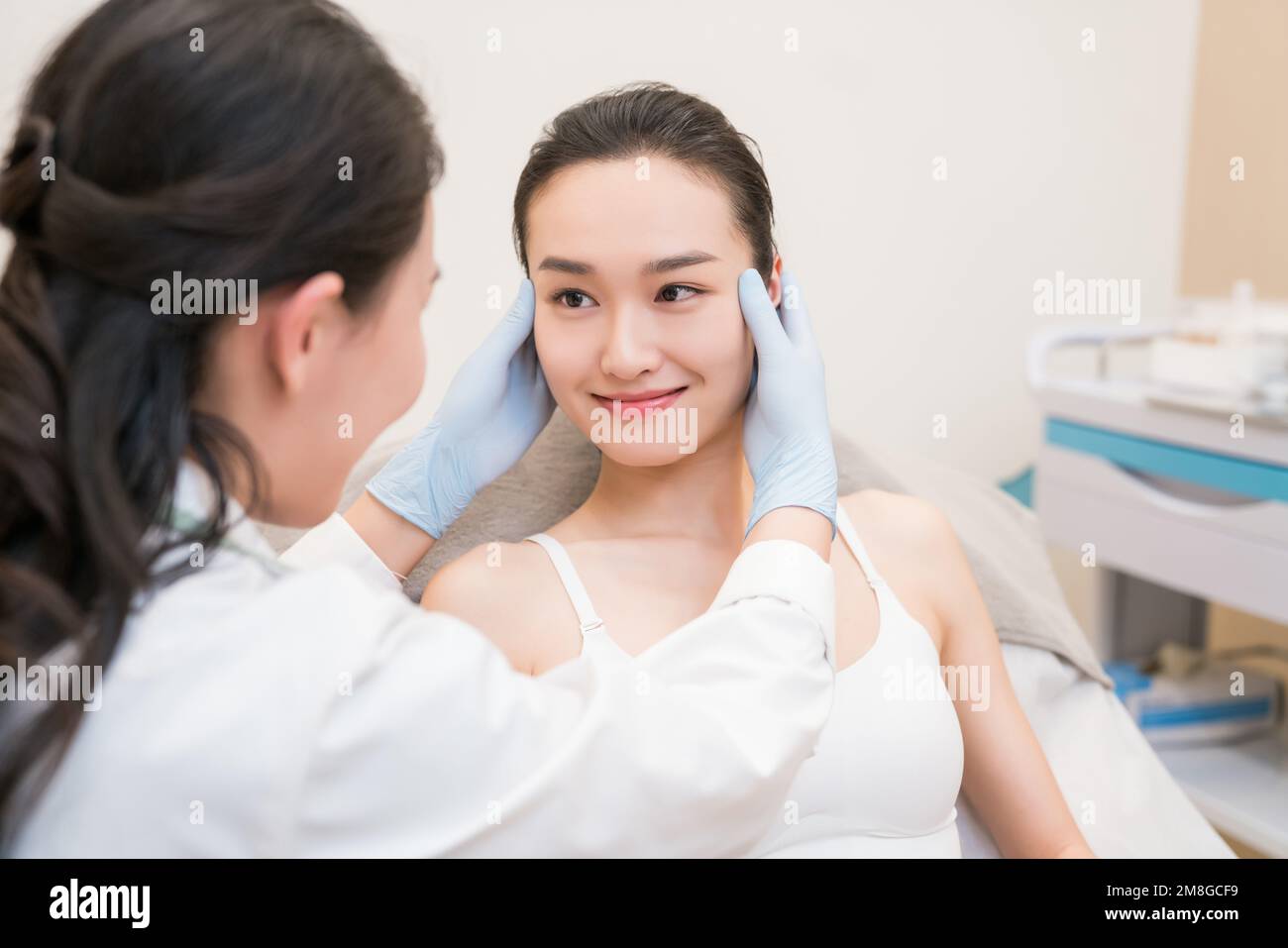 Professional reception young woman Stock Photo - Alamy