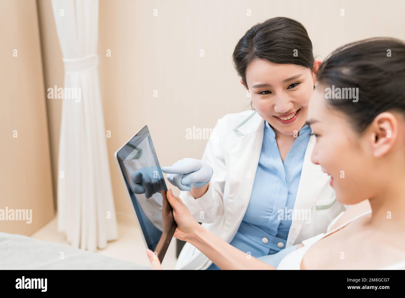 Professional reception young woman Stock Photo - Alamy