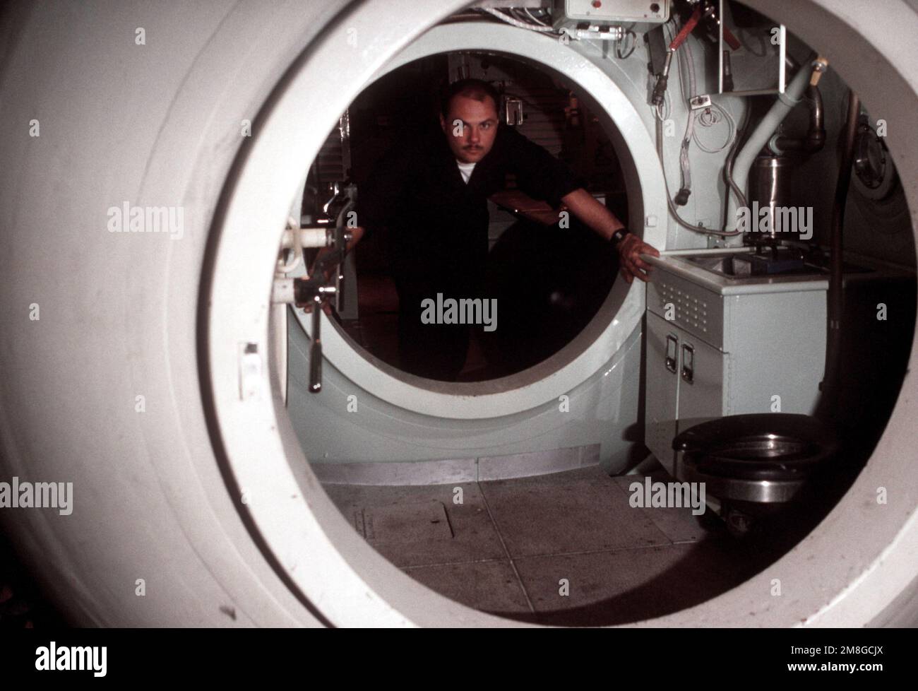 Hull Technician 1ST Class (Diver) Mark Whitlow inspects a pressure ...