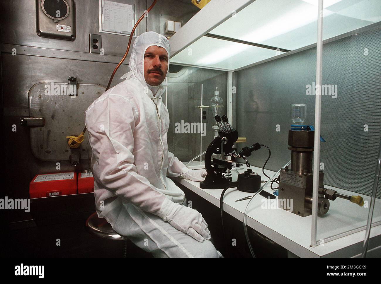 A crew member aboard the submarine rescue ship USS PIGEON (ASR-21 ...