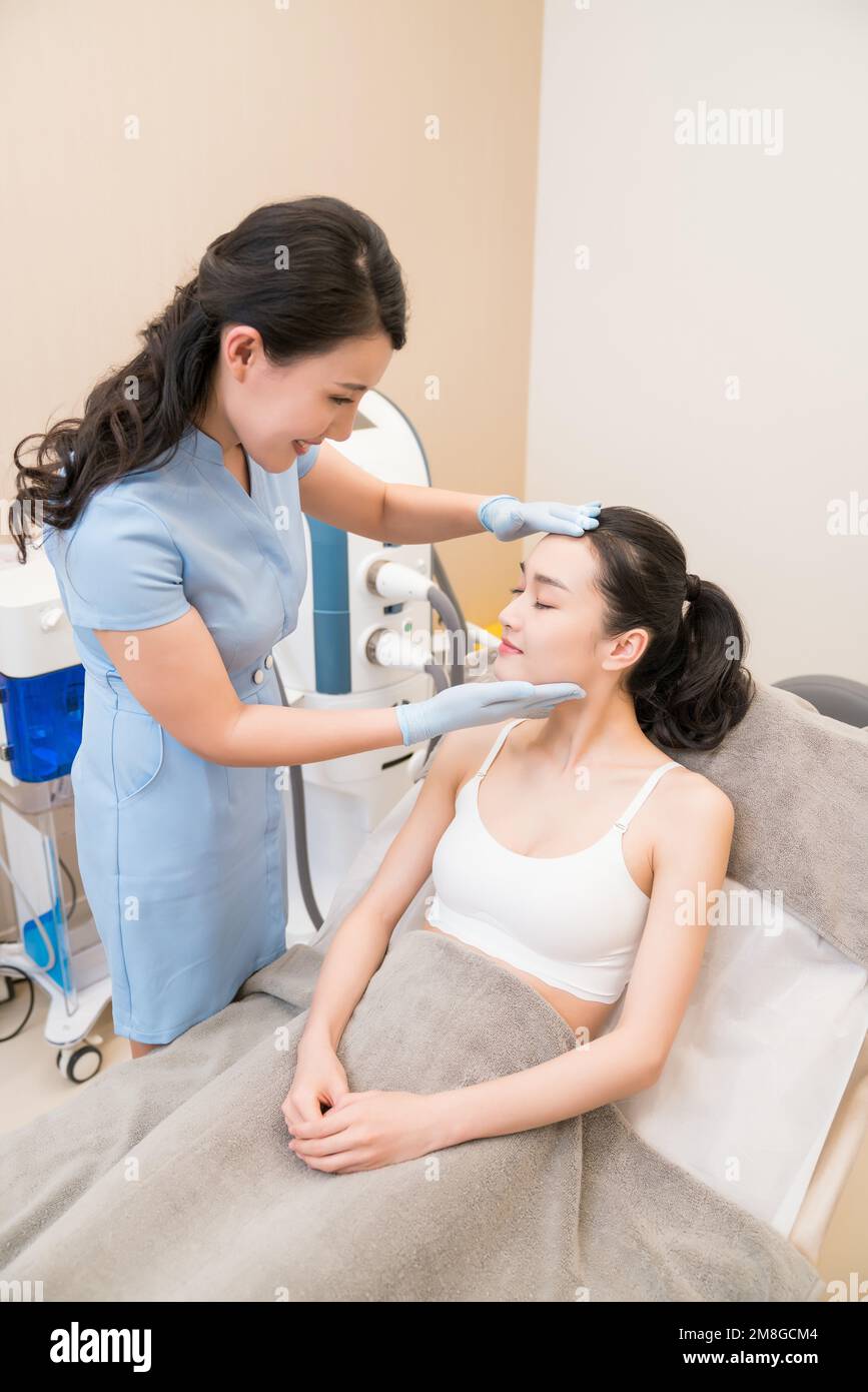 Professional reception young woman Stock Photo - Alamy