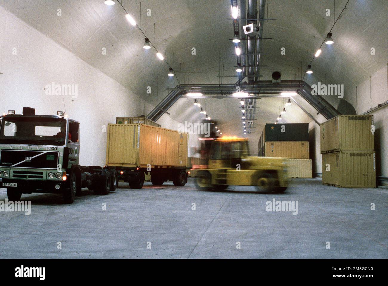 Containers holding components of a fleet hospital are placed in a ...