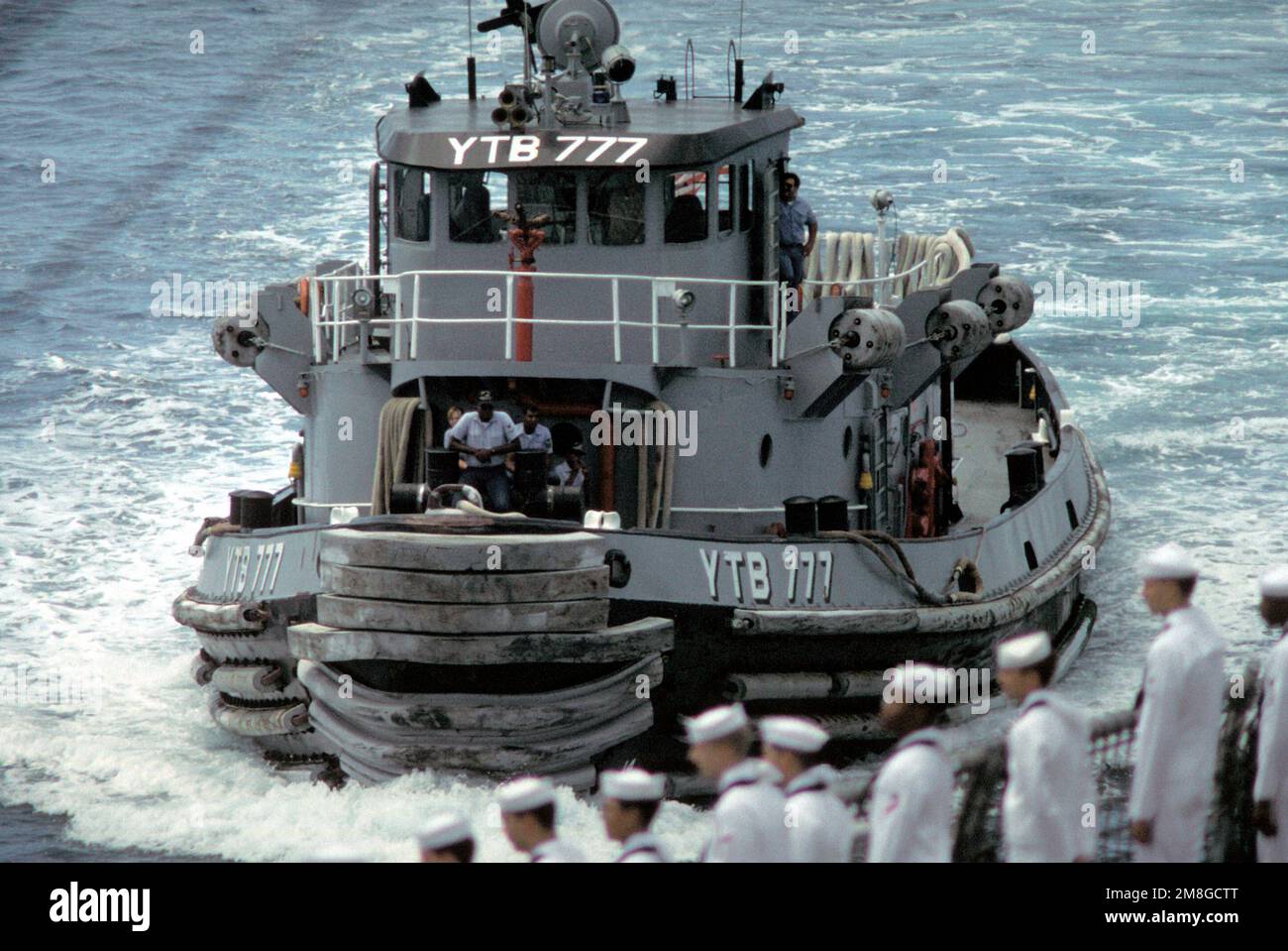 Sailors aboard the arriving amphibious command ship USS BLUE RIDGE (LCC ...