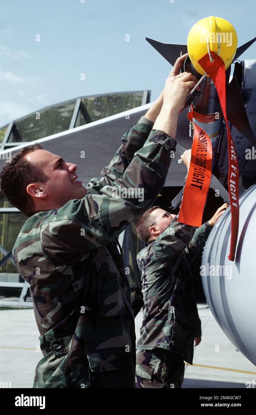 SENIOR AIRMAN Gary Ross of the 53rd Fightrer Squadron disarms an AIM-9 ...