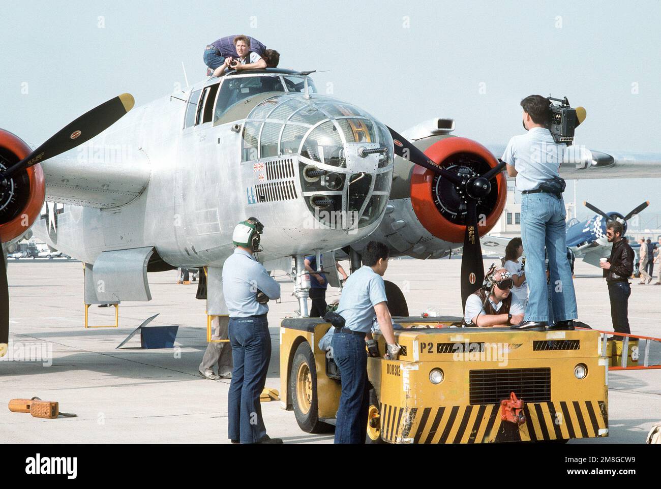 Photographer's mates photograph a restored B-25 Mitchell bomber ...