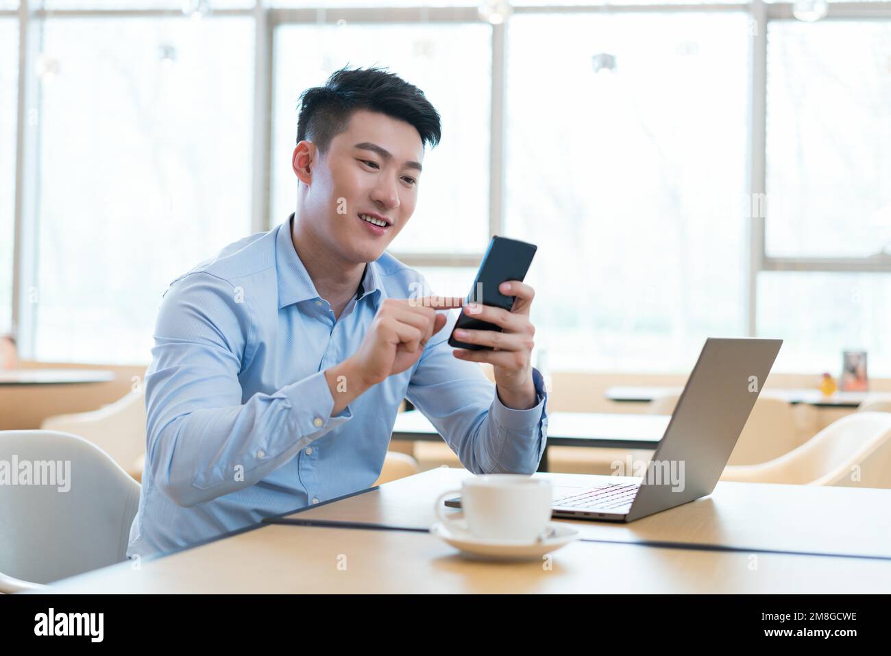 Business men in the Internet cafe Stock Photo - Alamy