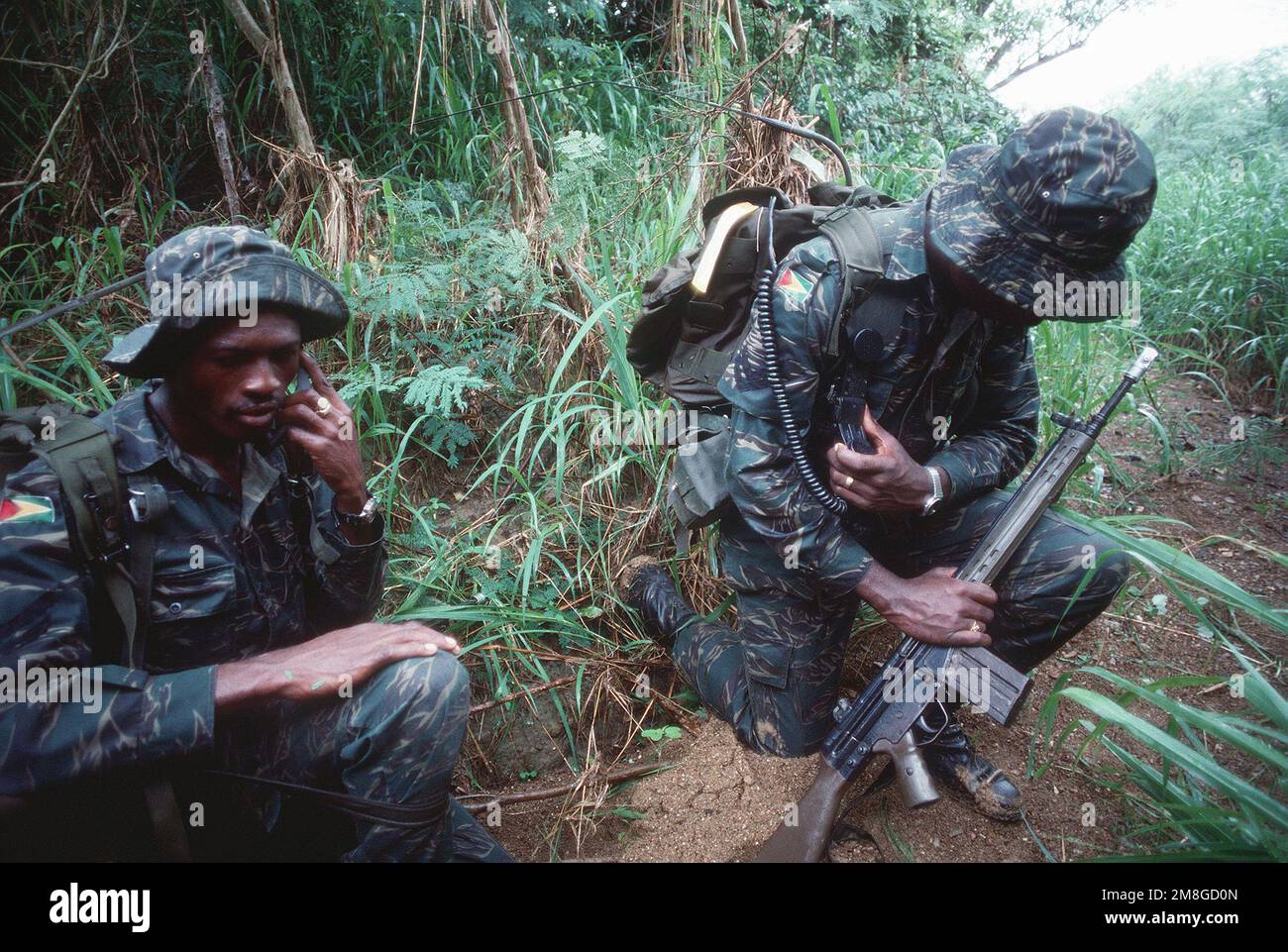 Soldiers of the Guyana Defense Forces relay information to other ...