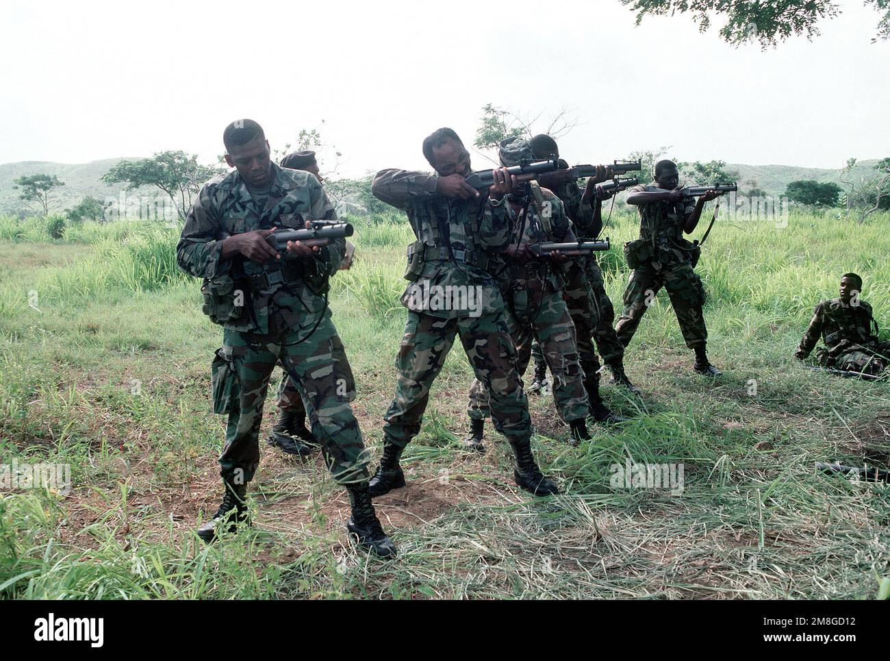 Soldiers sight in with their M-70 40mm grenade launchers during ...