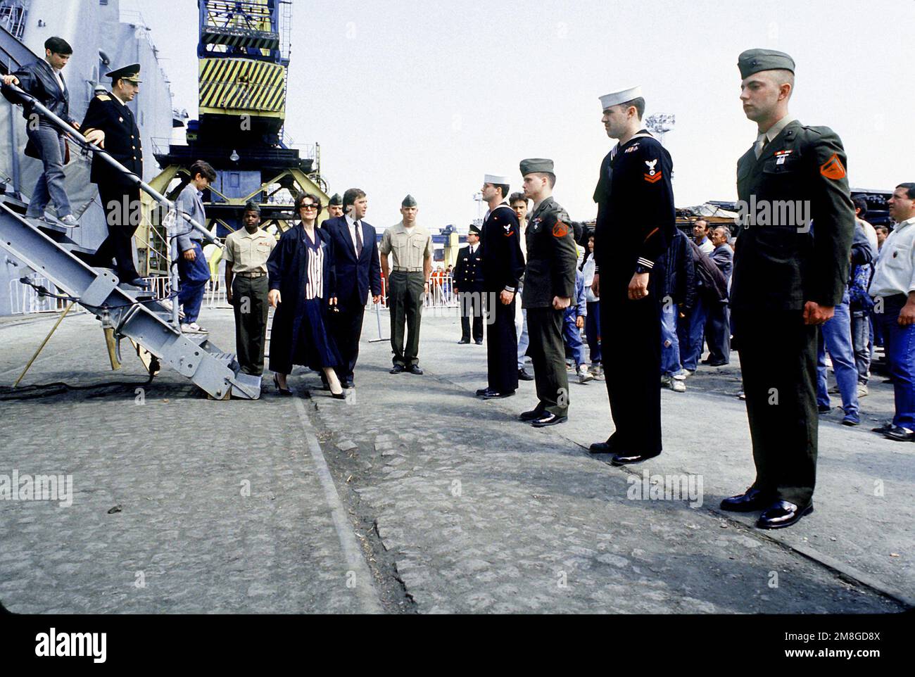 Sailors and Marines of the USS WHIDBEY ISLAND (LSD-41) stand at ...