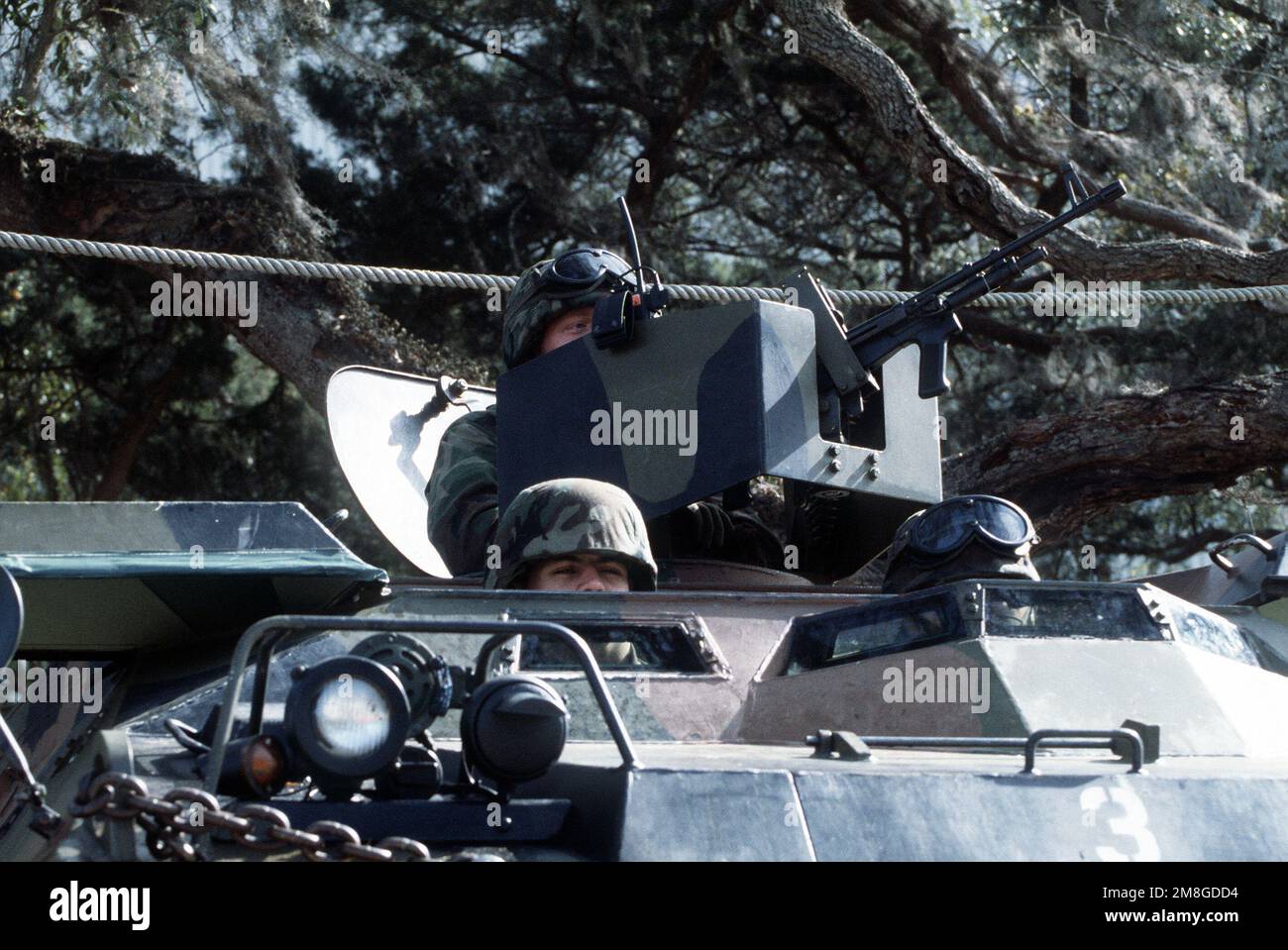 Marines of the Security Force Company patrol in a V-150 Commando ...