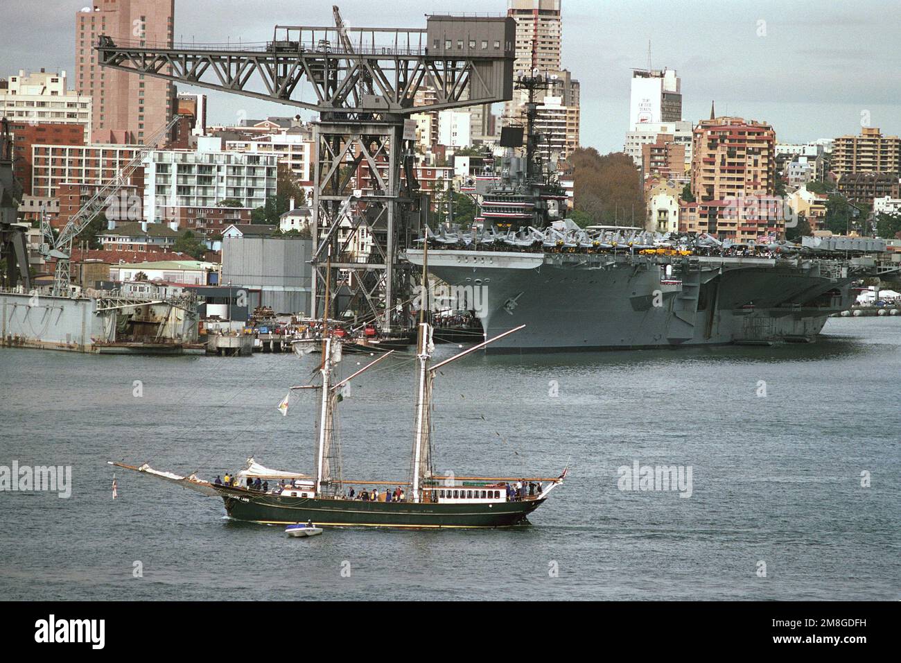 A view of the Sydney Naval Base with the aircraft carrier USS ...