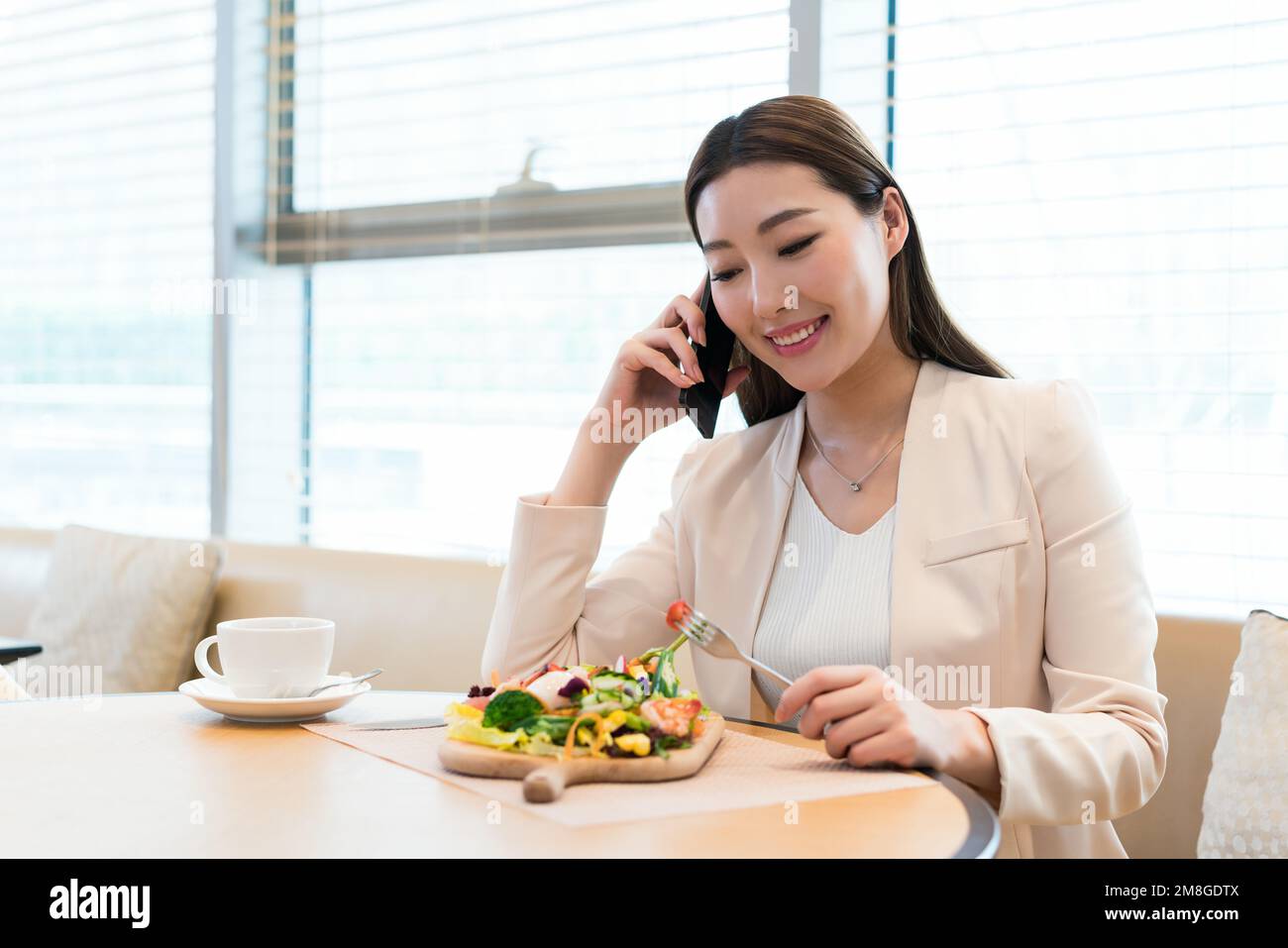 Young woman's afternoon tea time Stock Photo - Alamy
