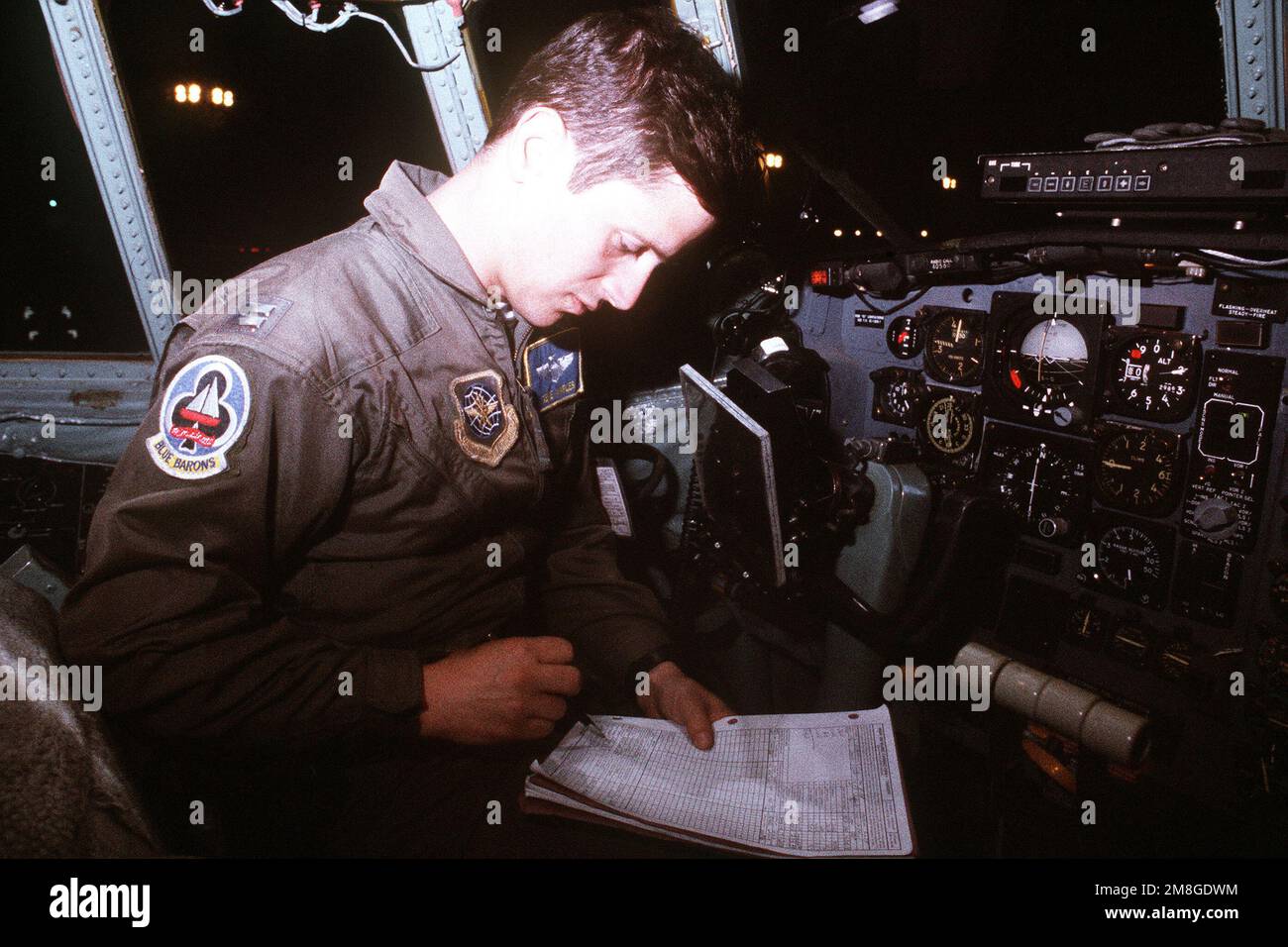 Pilot CAPT. Gene Maples sits in the cockpit of a 62nd Airlift Squadron ...