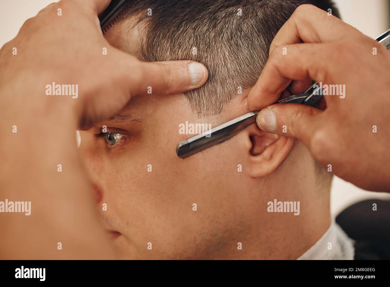 Barber shaving bearded man with retro knife Stock Photo - Alamy