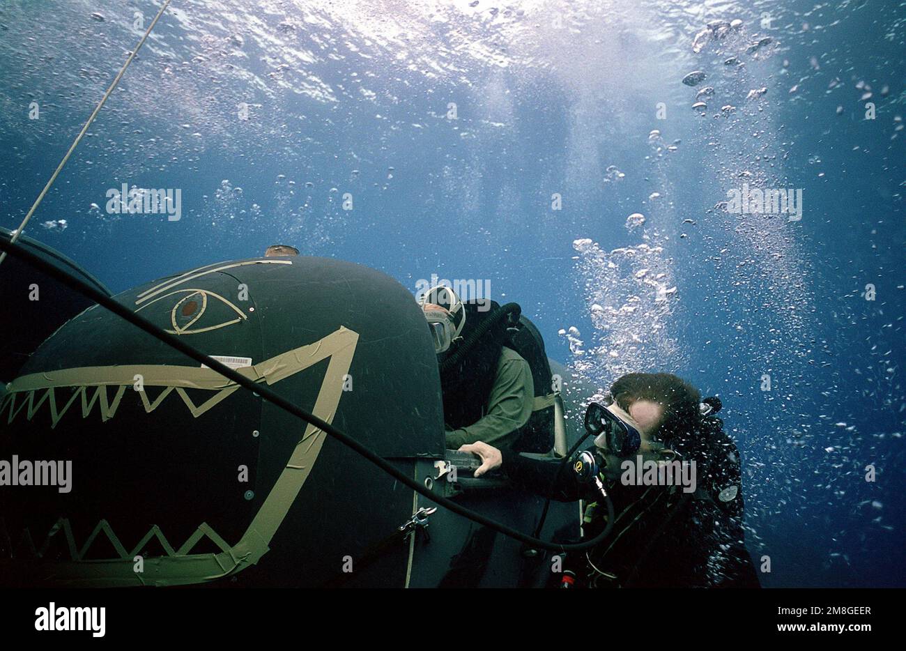 Sea-Air-Land (SEAL) team members of Swimmer Delivery Team 2 prepare a ...