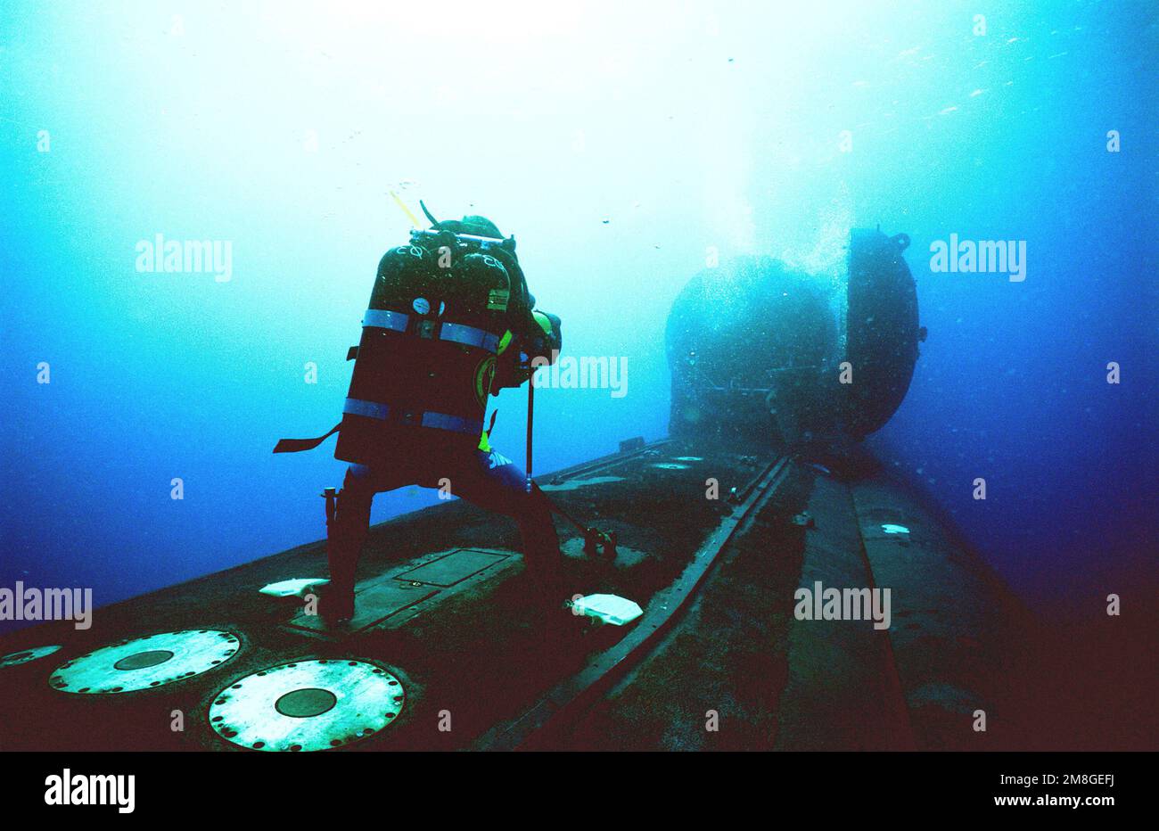 Photographer's Mate 1ST Class/Diver Slater stands ready to videotape ...