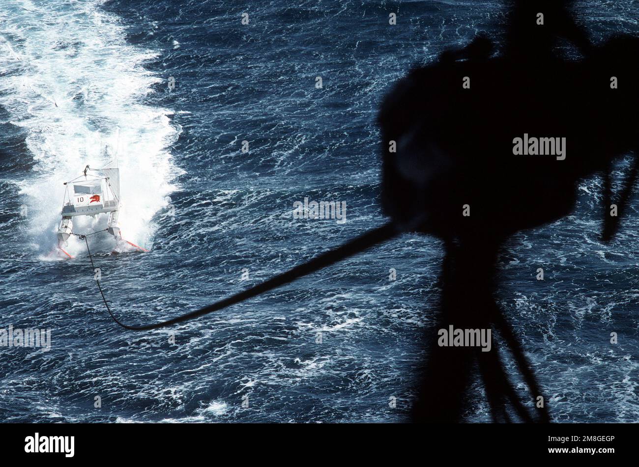 A Mark 105 hydrofoil minesweeping sled is towed in waters near Fort ...