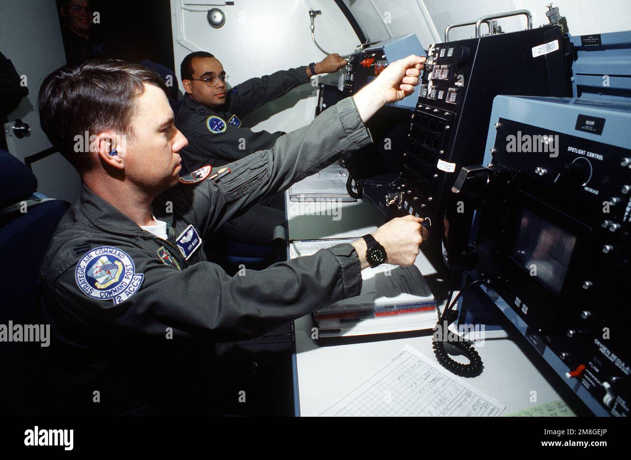 CAPT. Tom Neiss, foreground, airborne missile combat crew commander ...