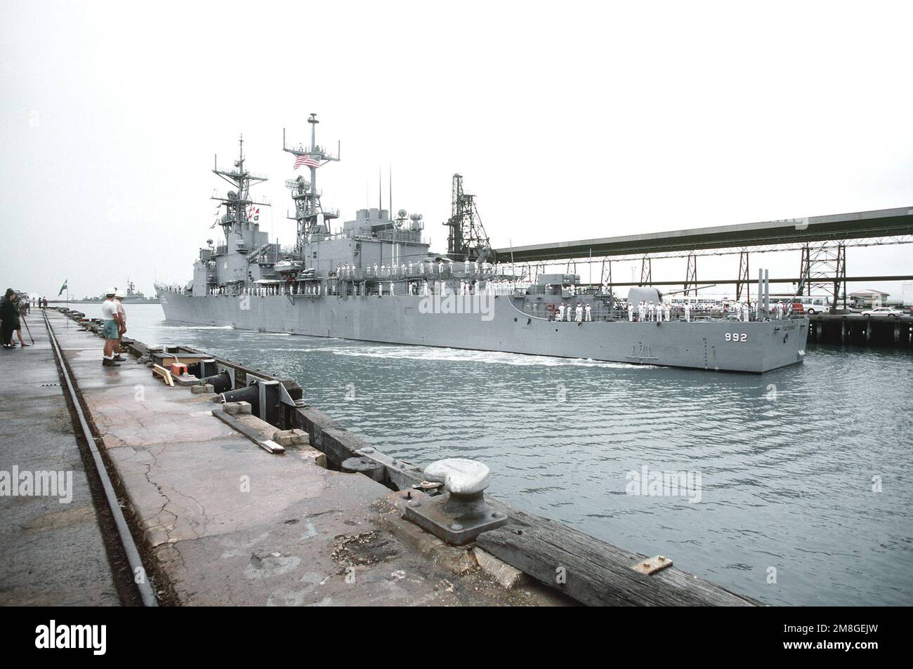 Sailors man the rails aboard the destroyer USS FLETCHER (DD-992) as the ...