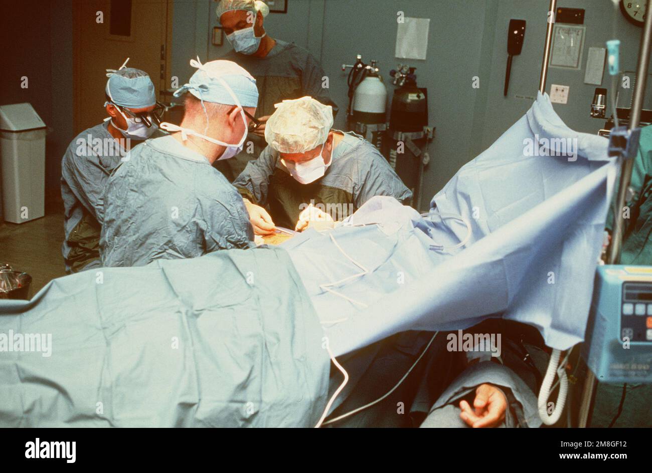 A surgical team performs an operation on the Military Sealift Command ...
