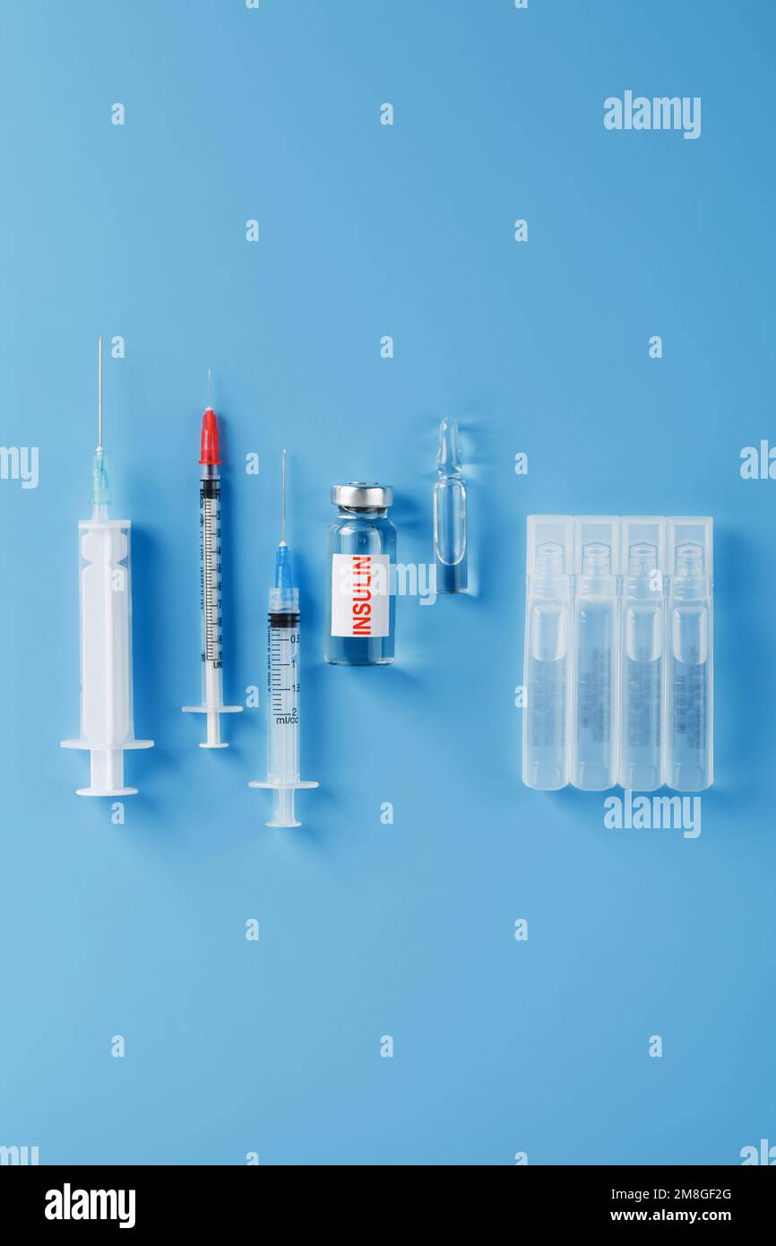 Ampoule bottle with insulin, needles and syringes for medical ...