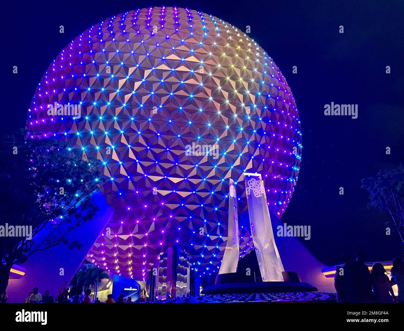 Wide angle shot of Spaceship Earth all light up at night. Walt Disneys ...