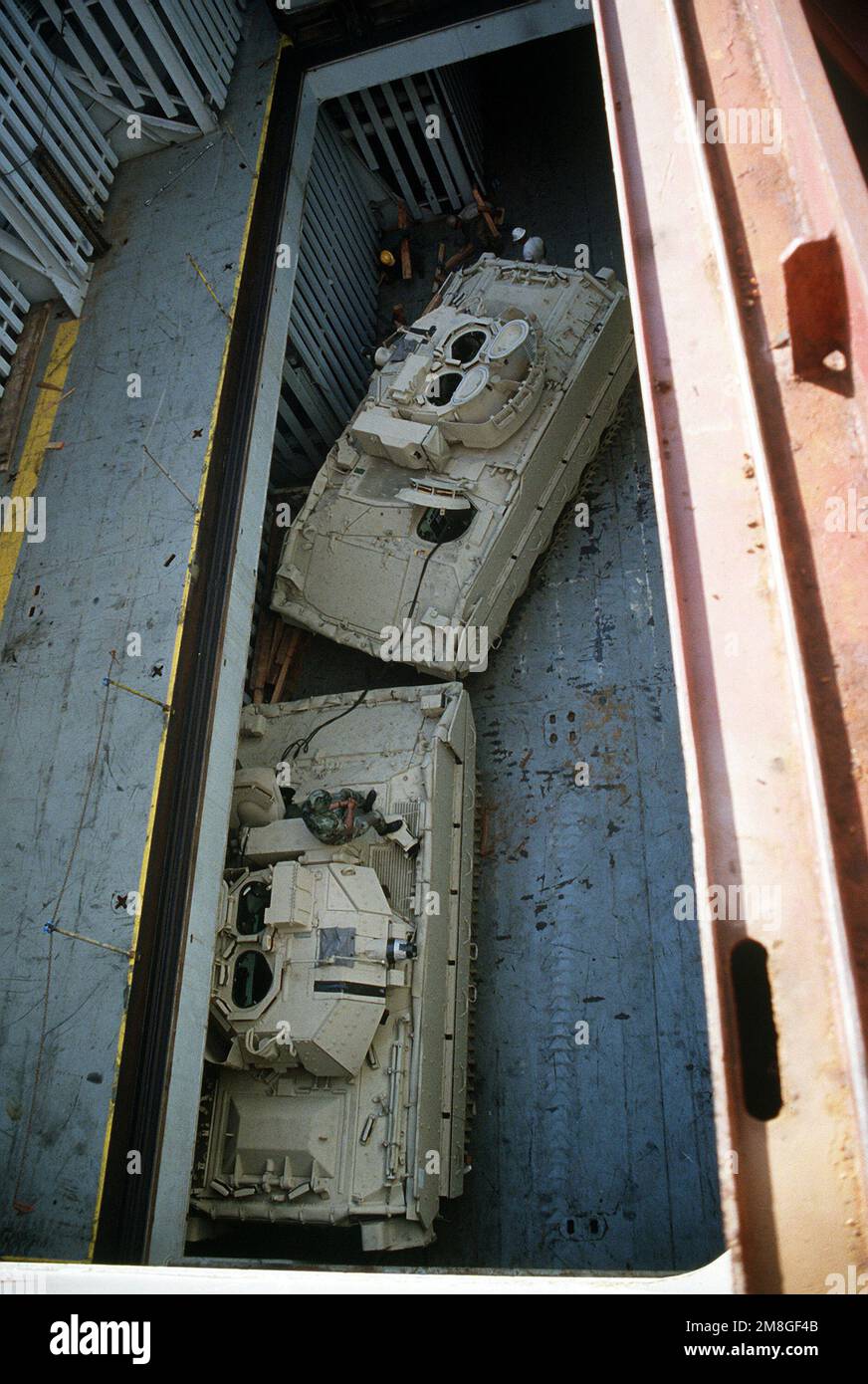 A M-2A2 Bradley infantry fighting vehicles about to be off-loaded from ...