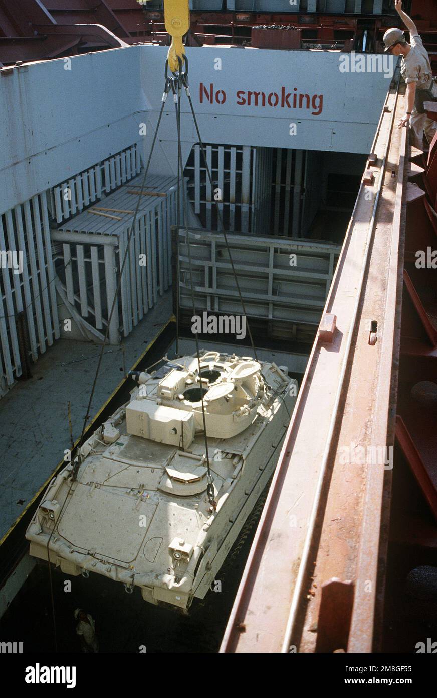 A M-2A2 Bradley infantry fighting vehicle is lifted from the MAERSK ...