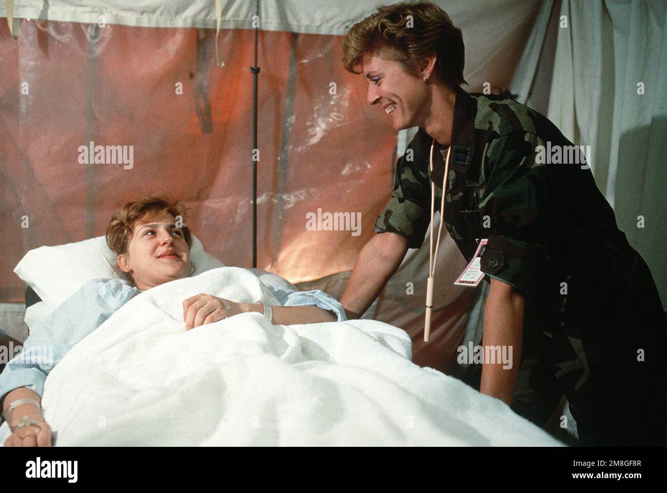 CAPT. Brenda Jones, a nurse with the 833rd Medical Group, checks ...
