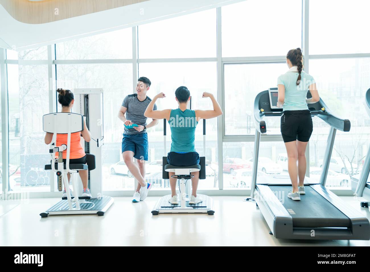 Young people in the gym Stock Photo - Alamy