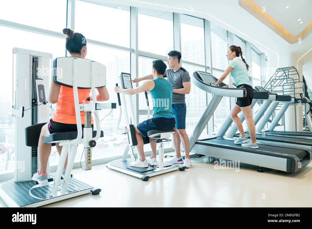 Young people in the gym Stock Photo - Alamy