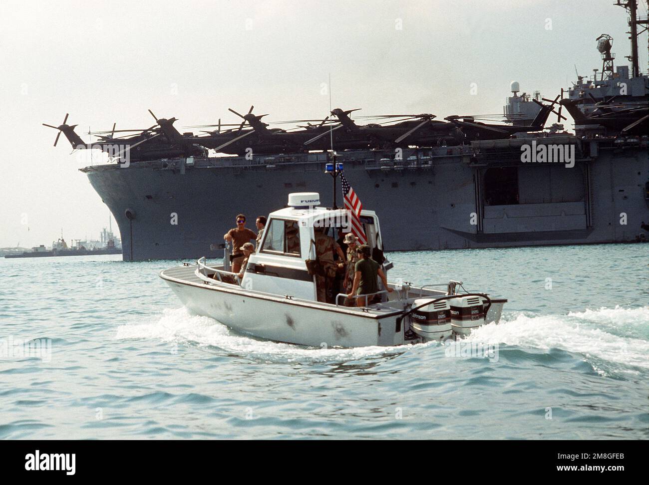 U.S. Coast Guard Port Security Unit 302 crew members patrol in a Navy ...