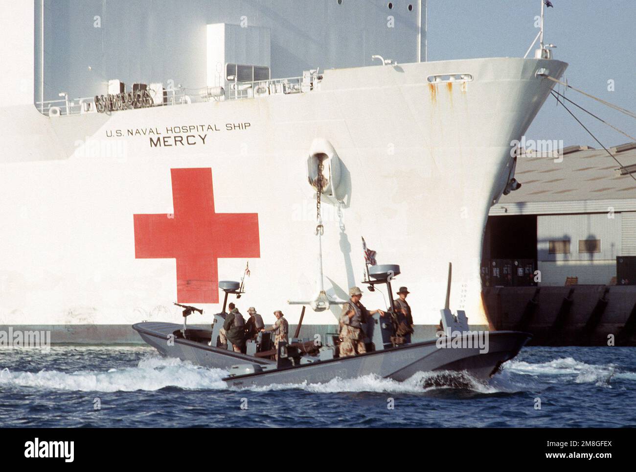 U.S. Coast Guard Raider boats pass in front of the Military Sealift ...