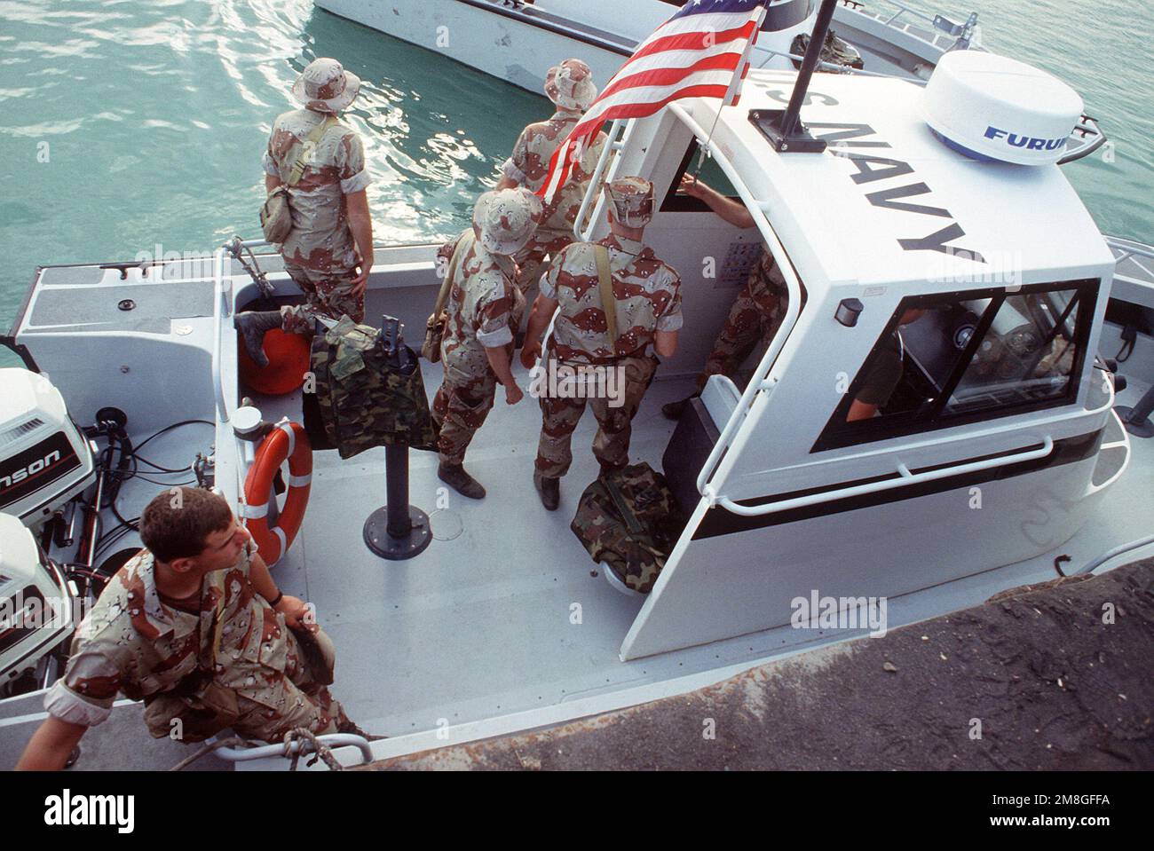 U.S. Coast Guard Port Security Unit 302 crew members patrol in a Navy ...