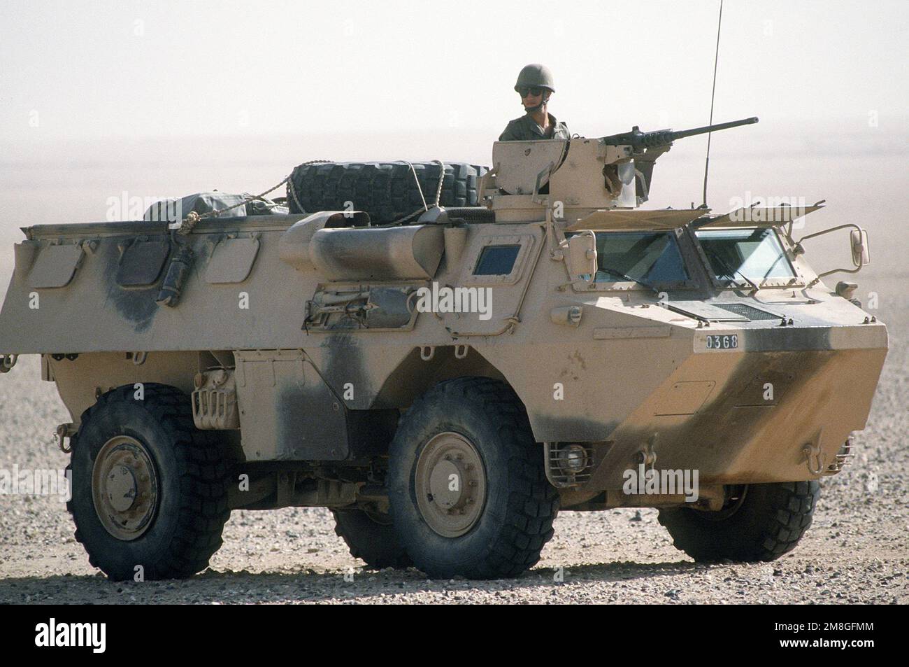 A soldier mans an M-2 .50-caliber machine gun atop a French Renault VAB ...